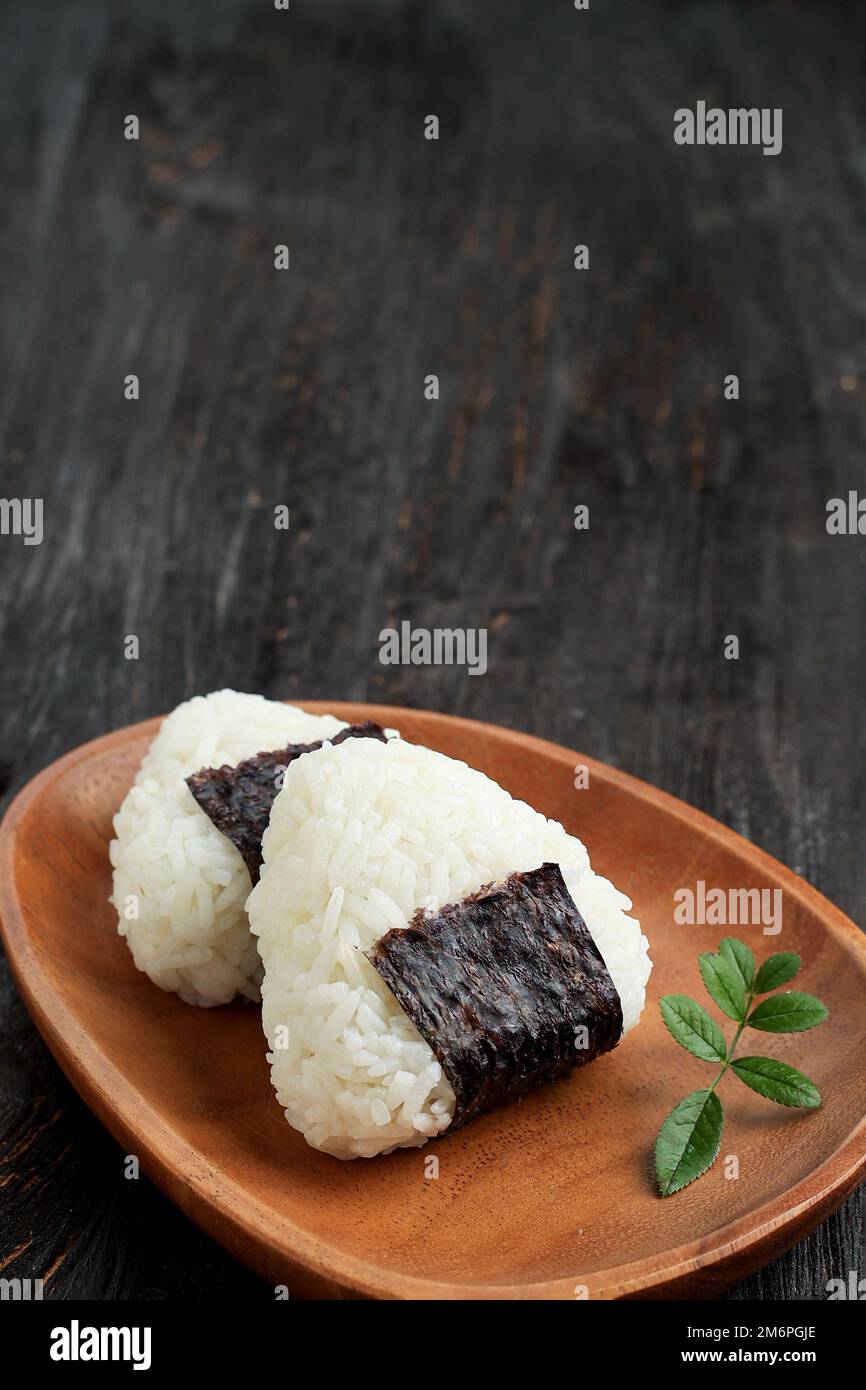 Onigiri, Japanese Rice Triangle with Nori Seaweed on Wooden Plate. Copy ...