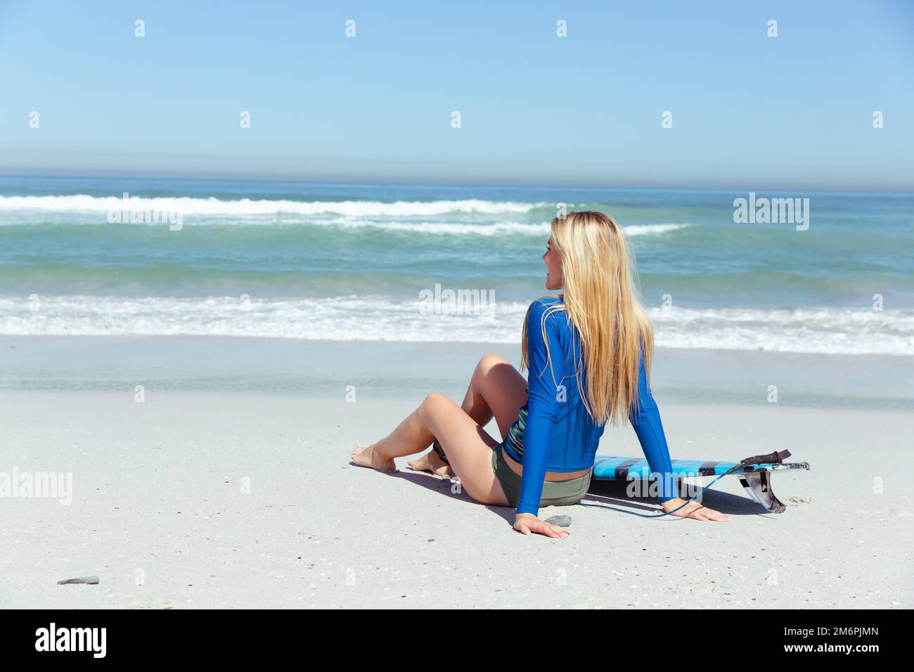 Caucasian woman during surf session at beach Stock Photo - Alamy