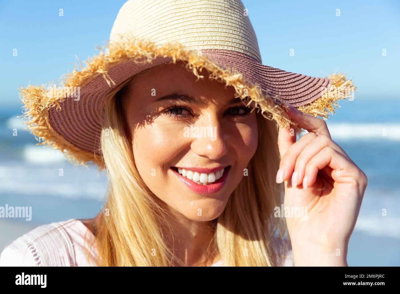 Caucasian woman enjoying at beach Stock Photo - Alamy