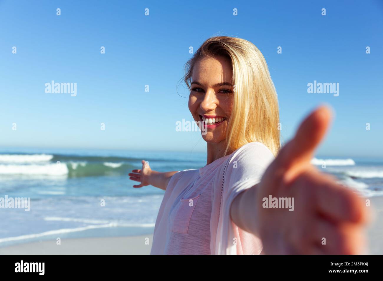 Caucasian woman enjoying at beach Stock Photo - Alamy