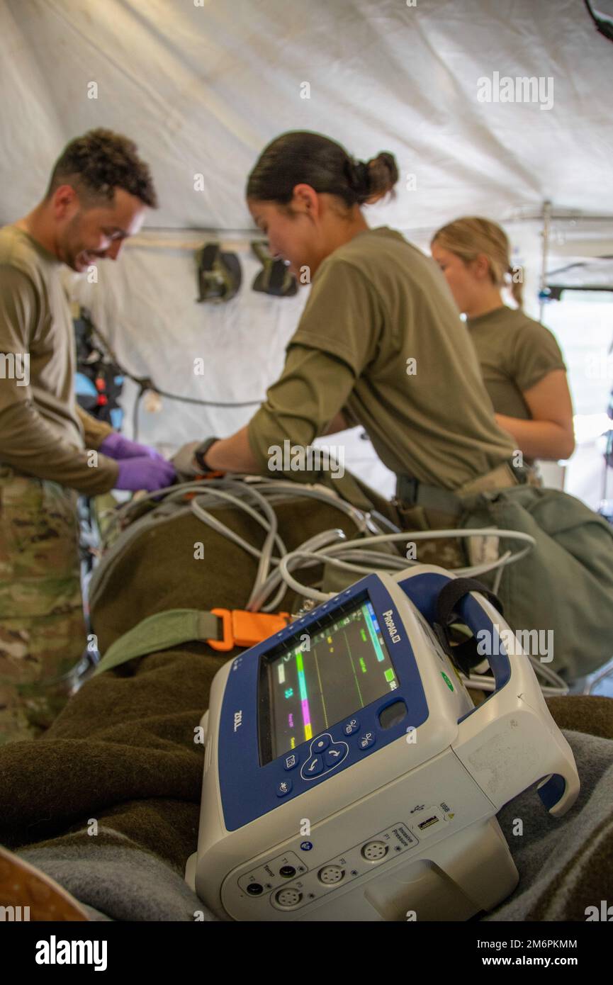 U.S. Army soldiers assigned to the 512th Field Hospital tending to a ...