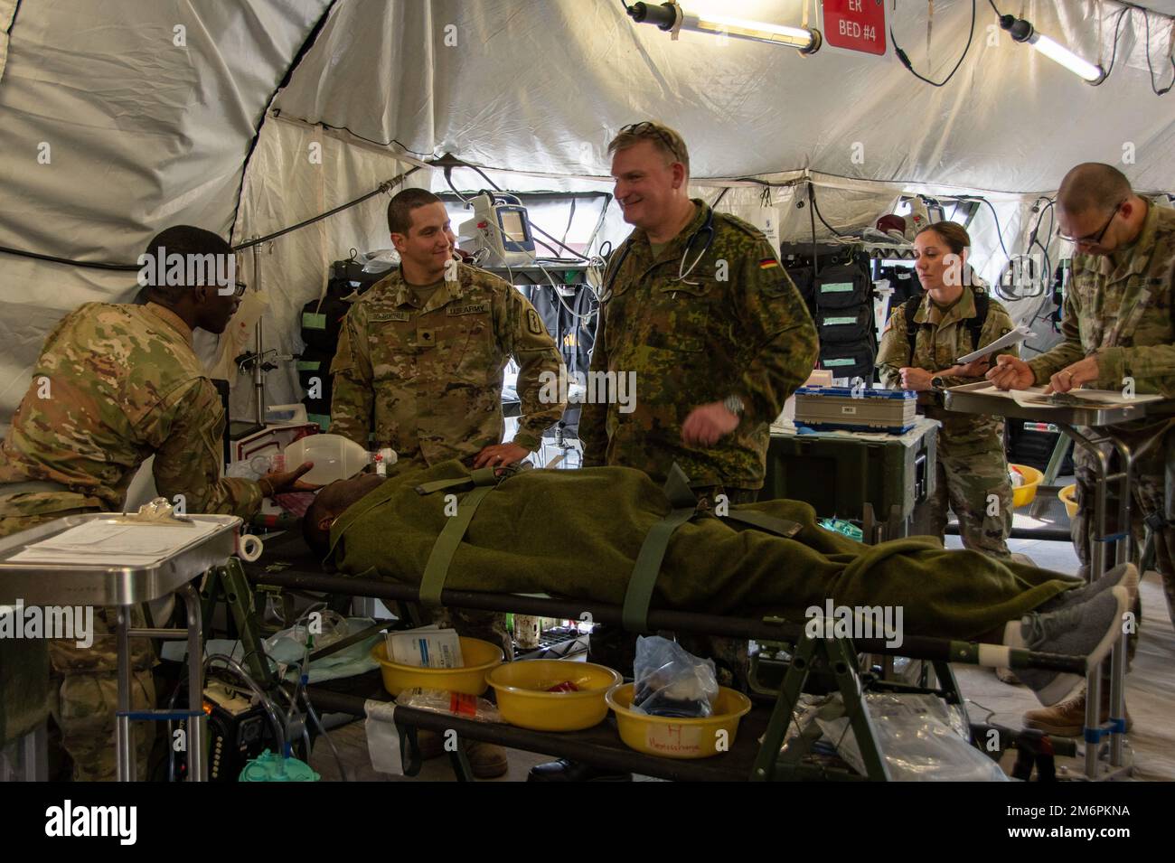 U.S. Army Staff Spc. Beau Schaechterle, 512th Field Hospital and a ...