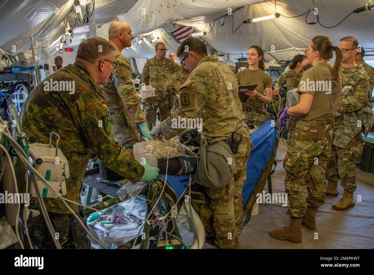U.S. Army Staff Spc. Beau Schaechterle, 512th Field Hospital and a ...