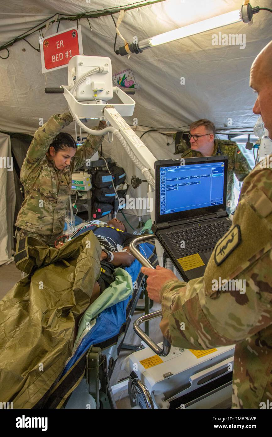 U.S. Army X-Ray technicians assigned to the 512th Field Hospital ...
