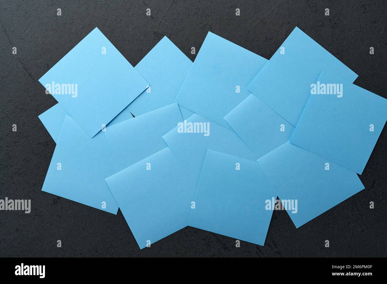 Blue paper stickers on black background. Sticky notes blank with copy ...