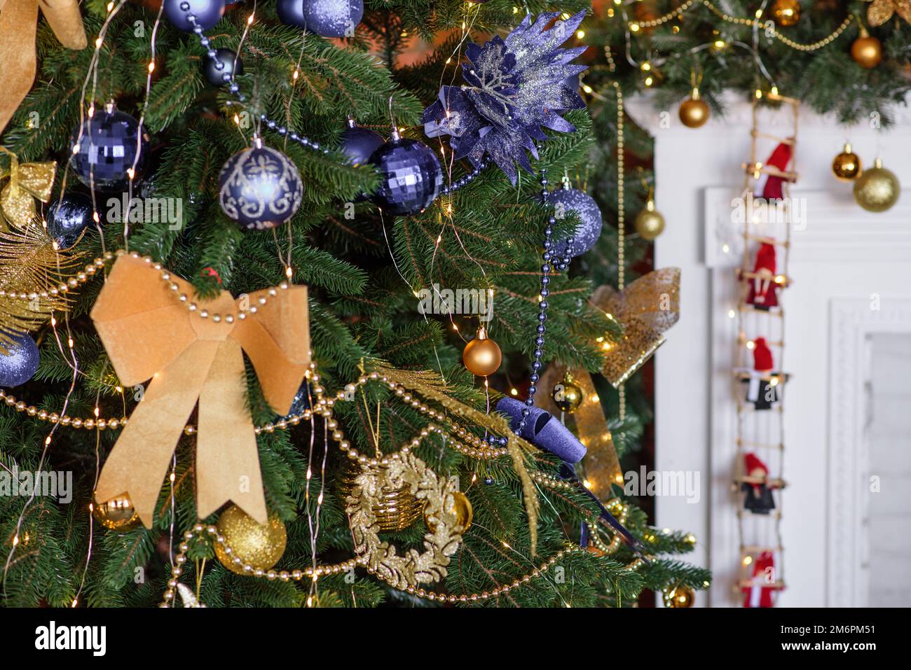 Beautiful Christmas tree with garlands, balls and toys. Preparing your ...