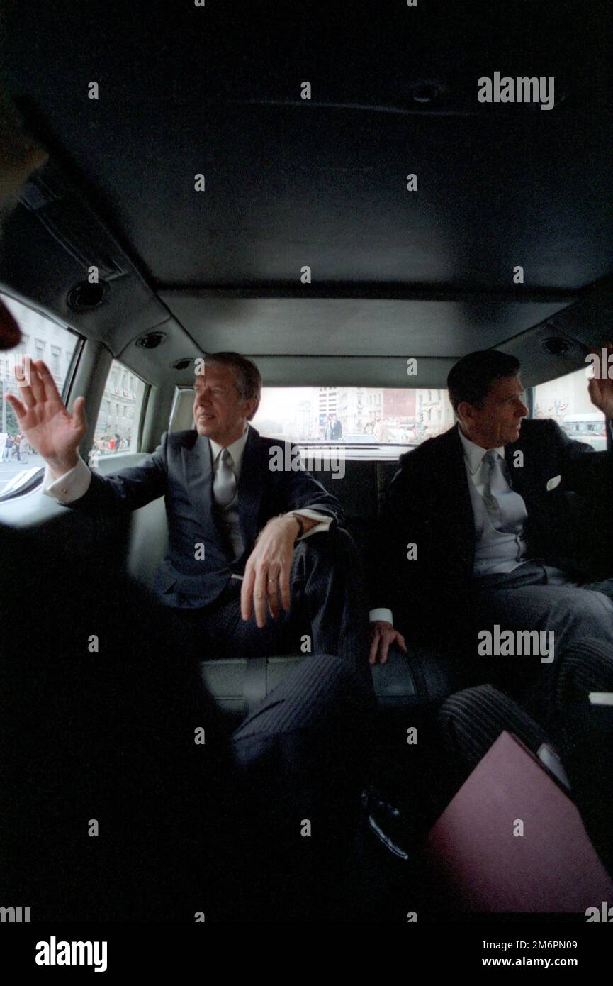 President elect Ronald Reagan and President Jimmy Carter ride in a ...
