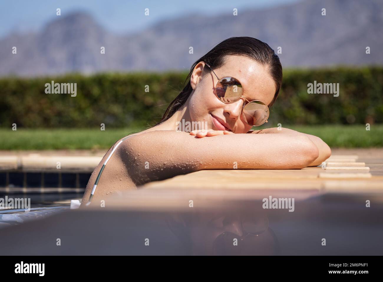 Portrait of woman with sunglasses in the pool Stock Photo - Alamy