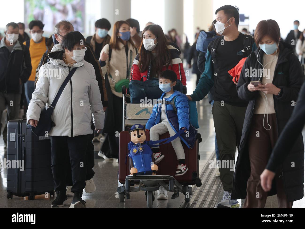 Passengers crowded at the departure hall during the peak day for travel ...