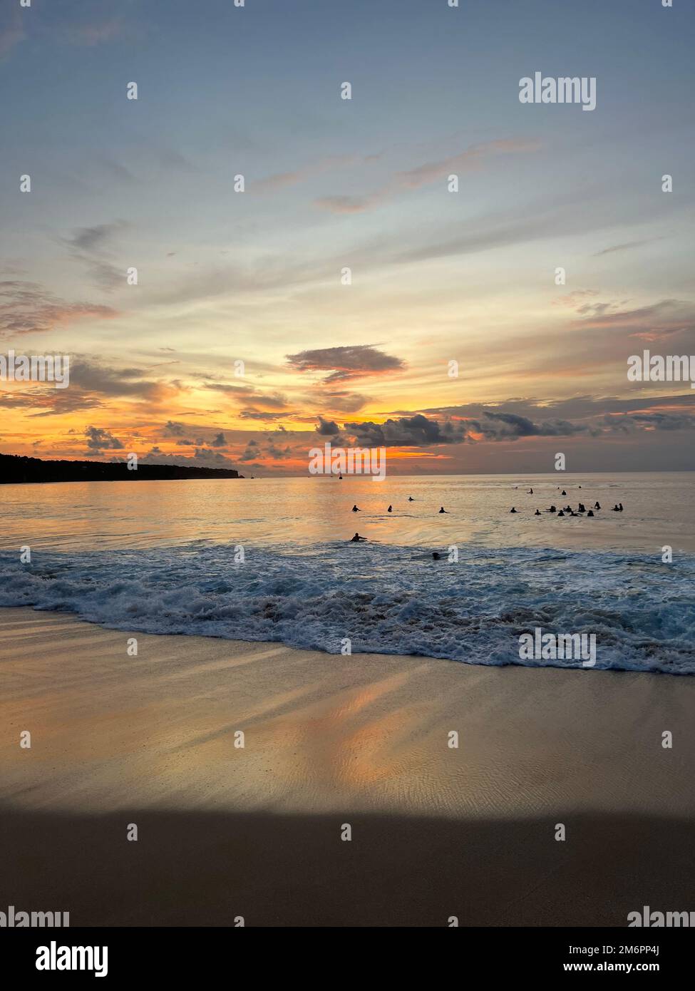A scenic shot of sea waves rolling on the shore of a beach during ...