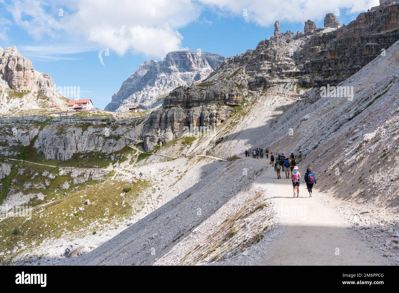 Dobbiaco, Italy-September 11, 2021:people on the path at the base of ...