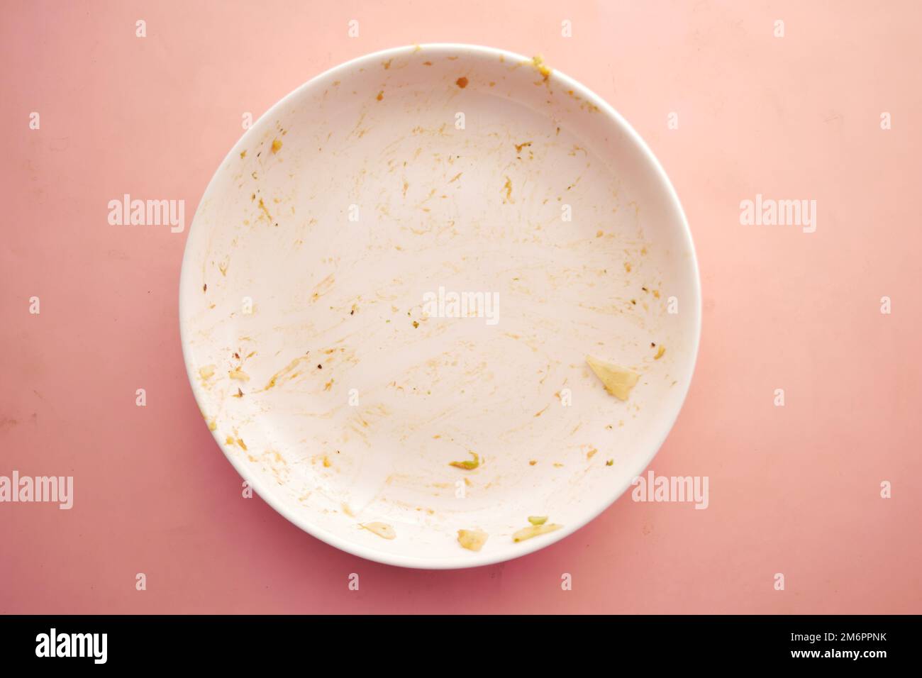 Empty plate after eating on table Stock Photo - Alamy