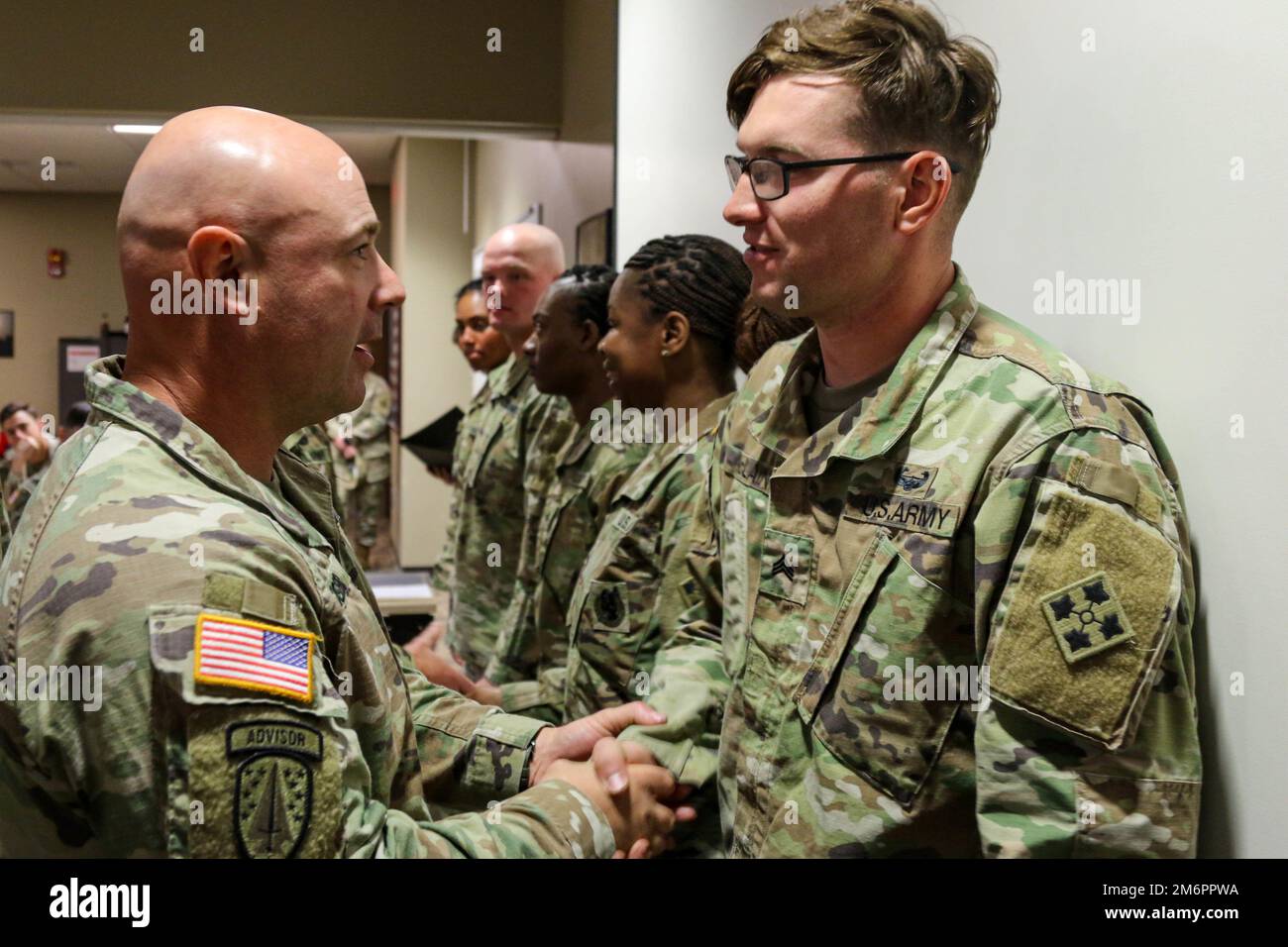 Col. Andrew Kiser, commander of 2nd Stryker Brigade Combat Team, 4th Infantry Division, presents ...