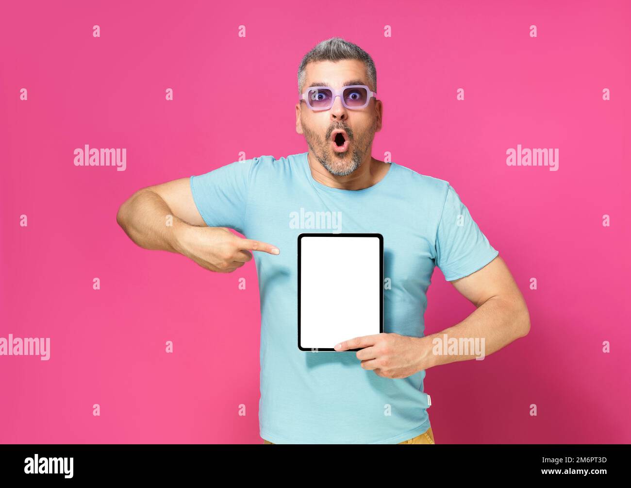 Great offer pointing at digital tablet white screen handsome man ...