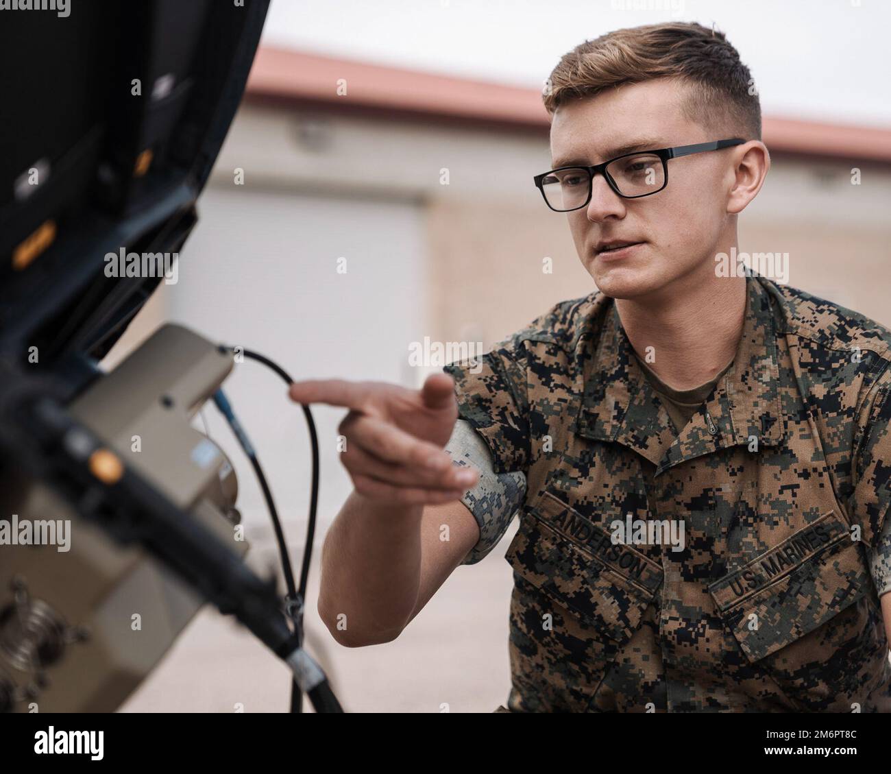 U.S. Marine Corps Lance Cpl. Matthew Anderson, a satellite ...