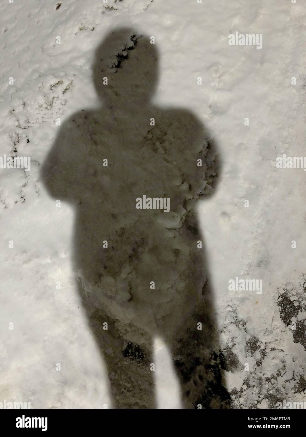 bigfoot shadow on snow, up Stock Photo - Alamy