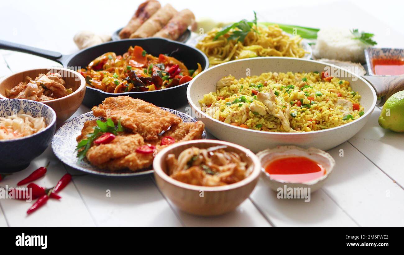 Chinese food set. Chinese noodles, fried rice with chicken, shrimps ...