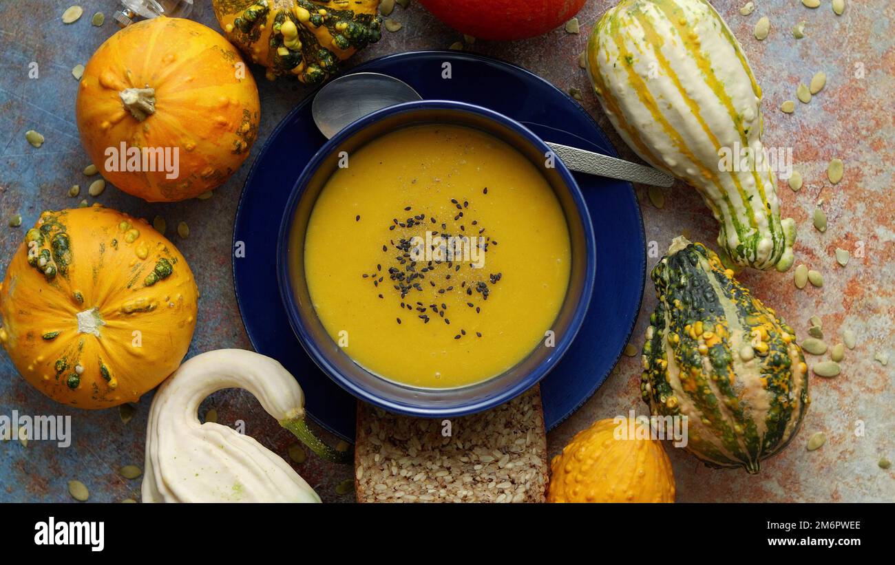Pumpkin puree isoup in bowl over rusty stone background. Healthy diet food concept Stock Photo ...