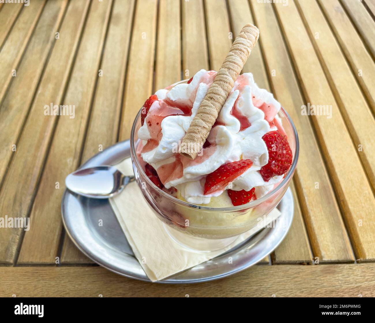 A strawberry sundae with cream and waffle Stock Photo - Alamy
