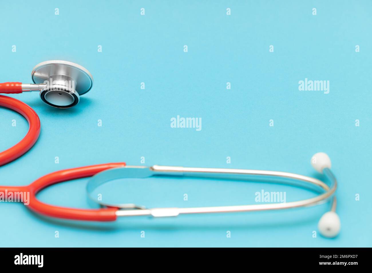 medical stethoscope on a blue background shot with blur. close-up shot ...