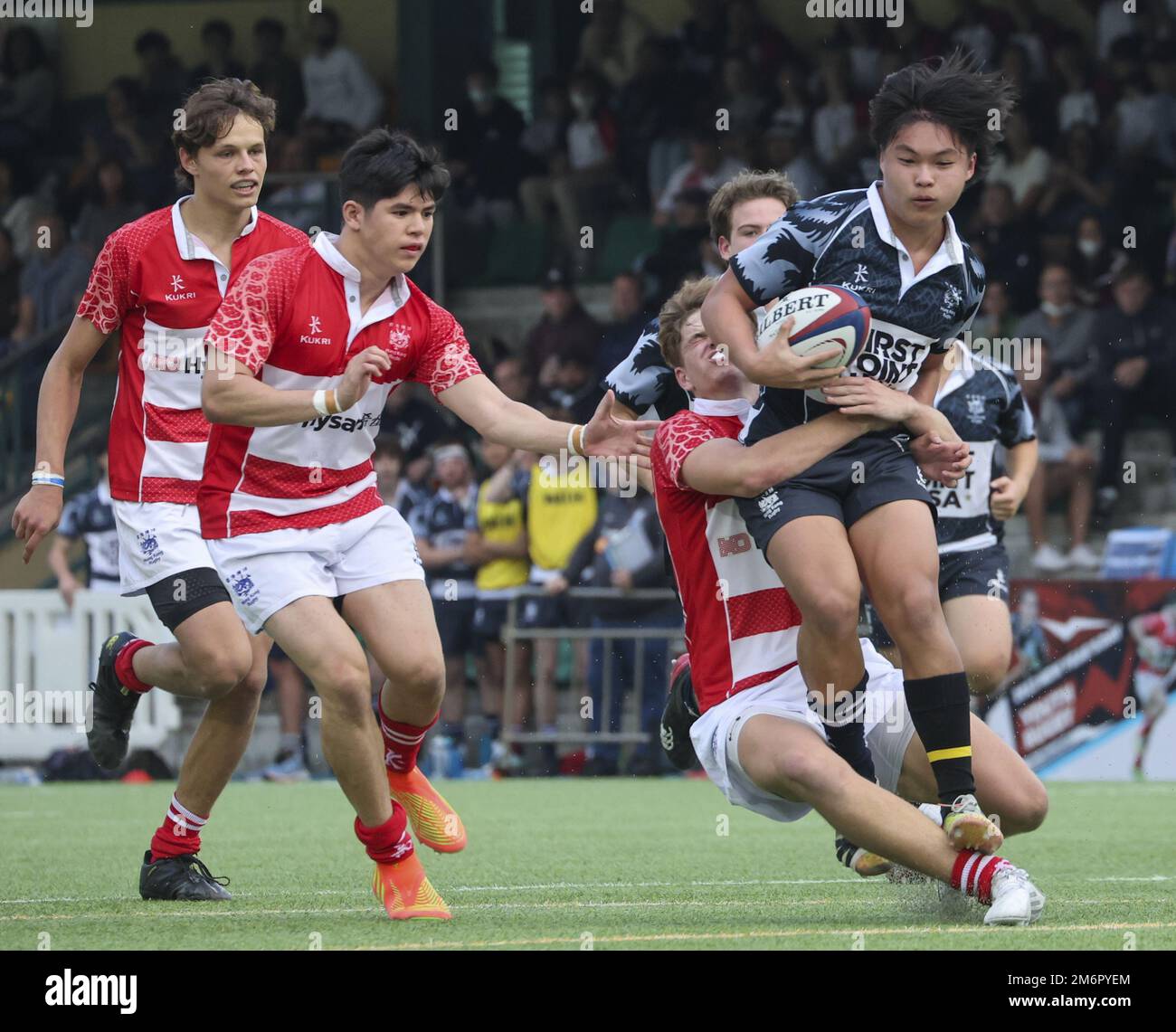 U19 Overseas Lions' Lucius Ng (Right, black shirt) in action a match ...