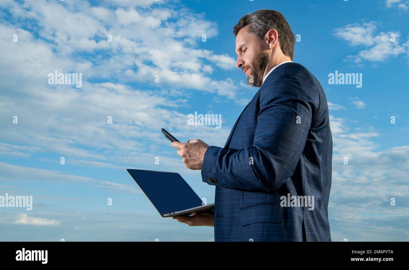 freelancer man with laptop and phone, copy space. photo of freelancer ...