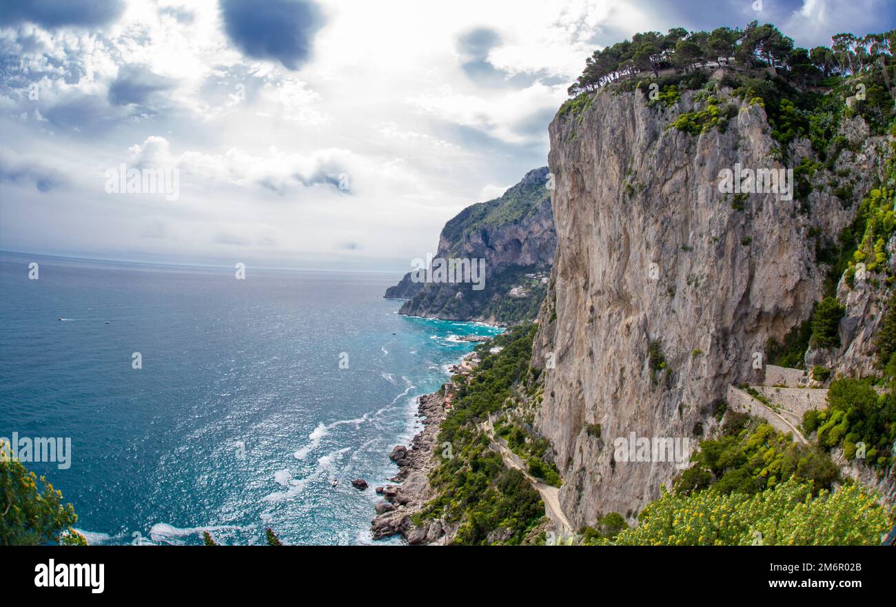 View from a cliff on the island of Capri, Italy, and rocks in the sea ...
