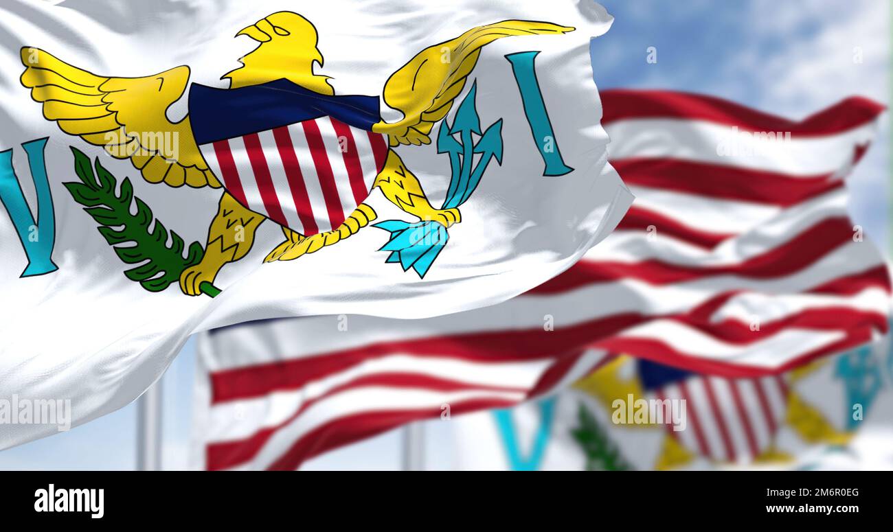 Flags of United States Virgin Islands waving in the wind with the US ...