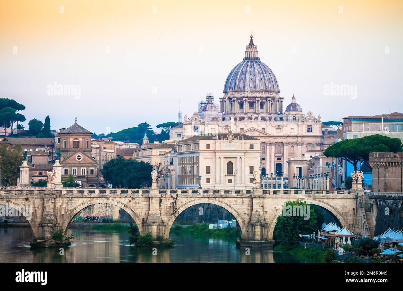 Sunset on Tiber river bridge with Vatican City - Rome, Italy Stock ...