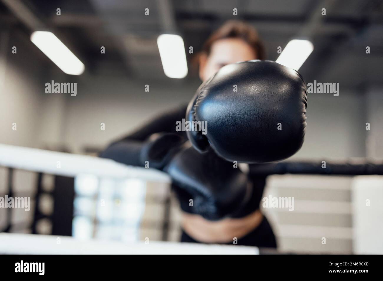 Strong latin boxing woman on the ring at fitness gym. Athletic girl ...