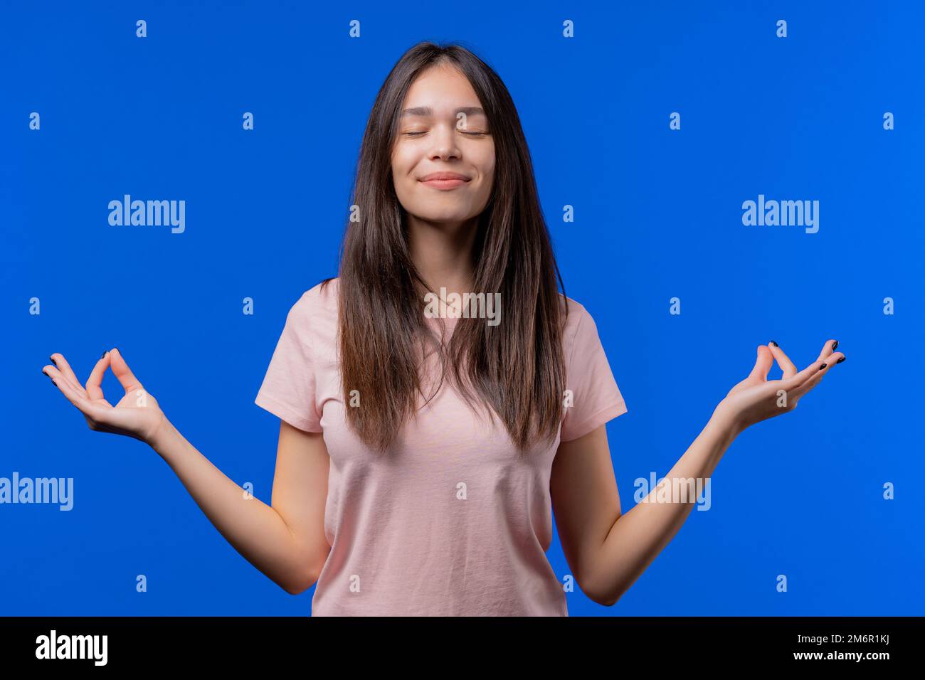 Calm woman relaxing, meditating, refuses stress. Young teen girl ...
