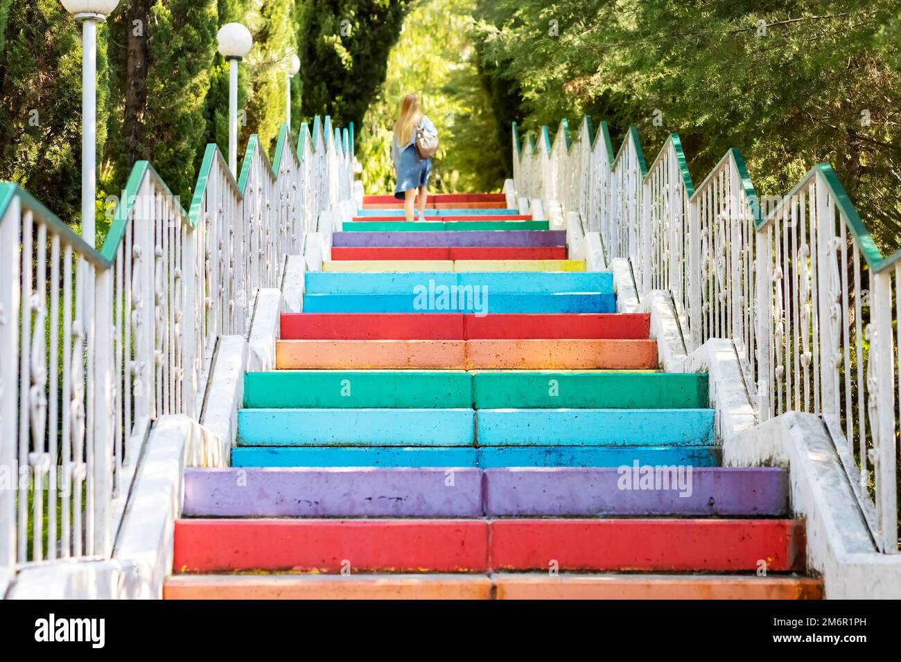 Colored, multi-colored steps. In the distance rises a woman out of ...