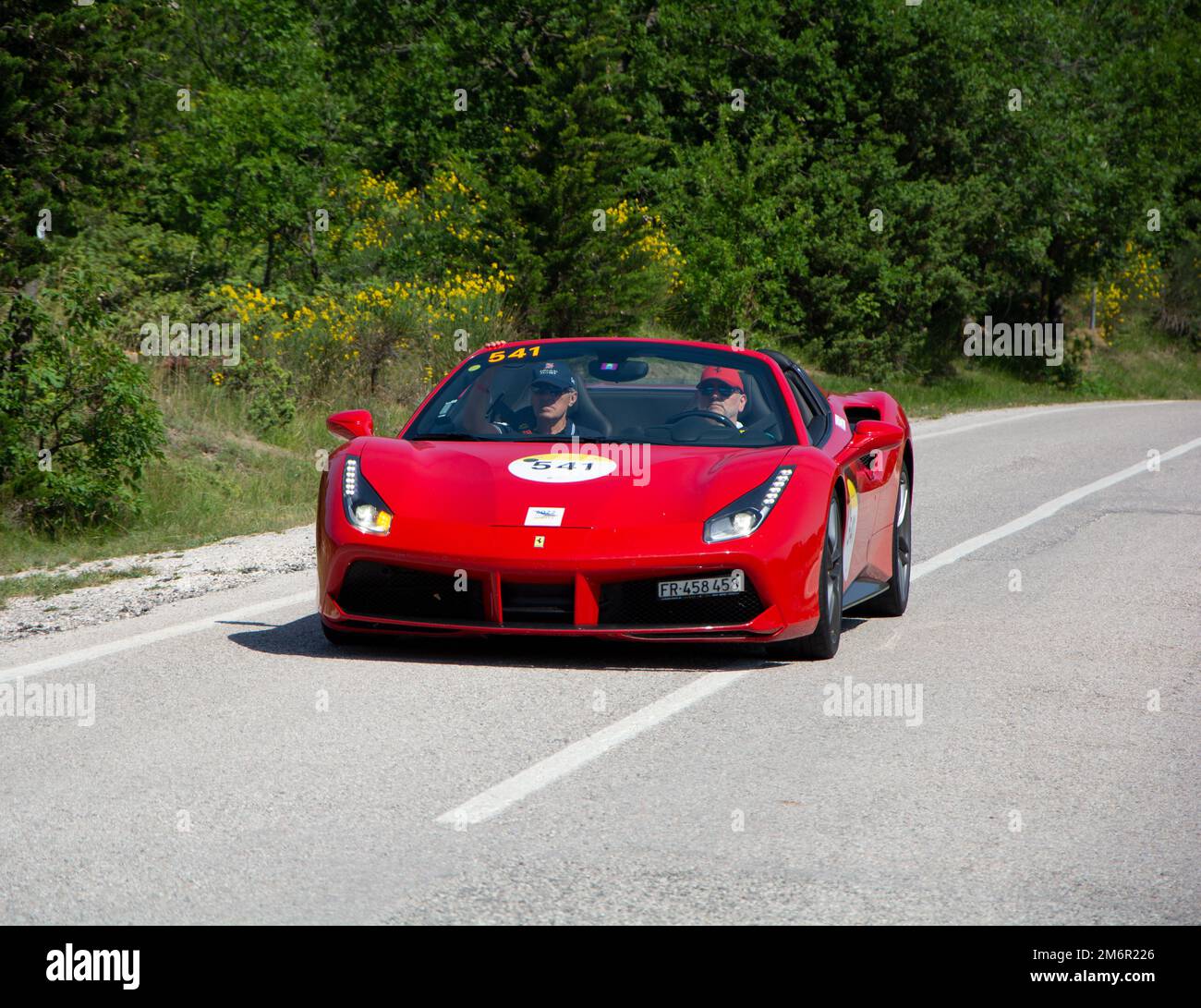 FERRARI 488 SPIDER 2017 on an old racing car in rally Mille Miglia 2022 ...