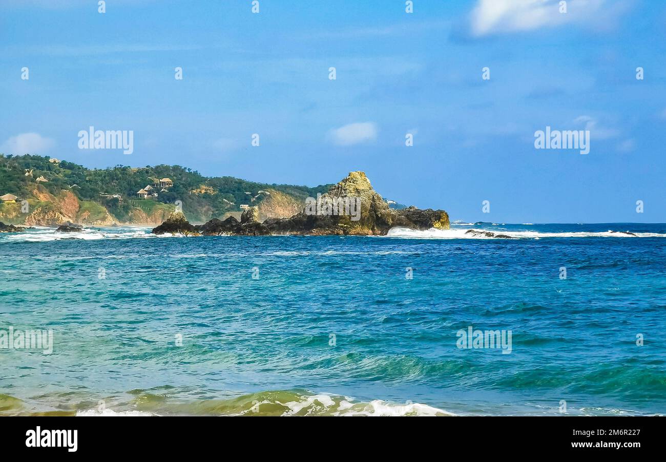 Beautiful paradise beach with mountains cliffs rocks high waves and ...