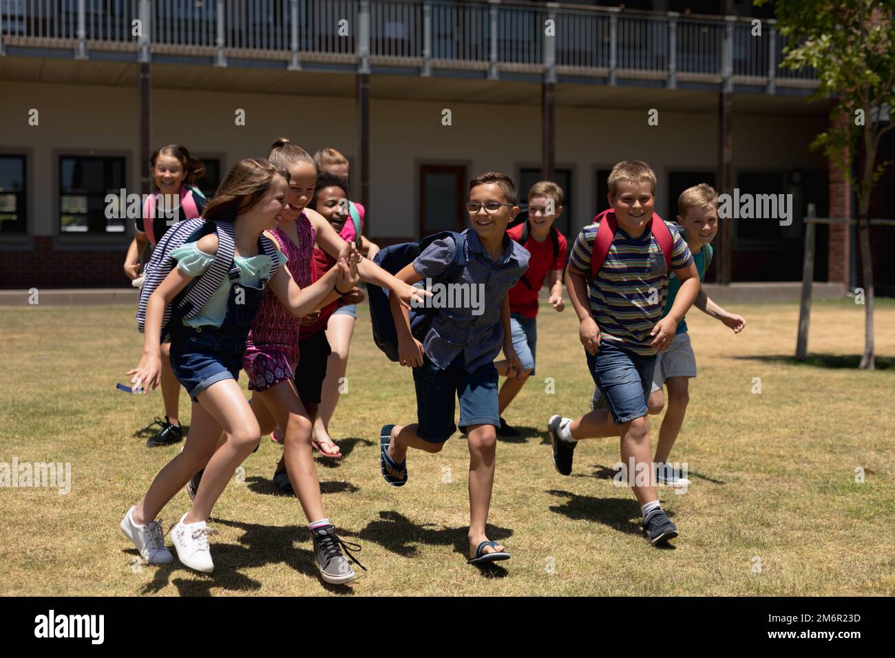 School children running in school playground Stock Photo - Alamy
