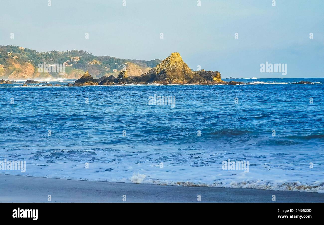 Beautiful paradise beach with mountains cliffs rocks high waves and ...