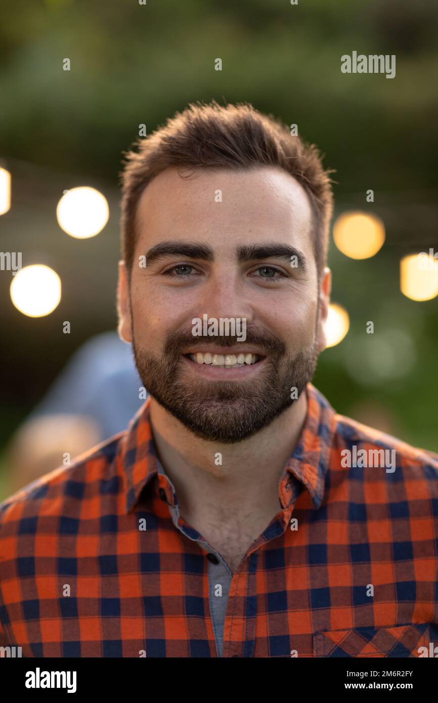 Caucasian man smiling and looking at camera Stock Photo - Alamy