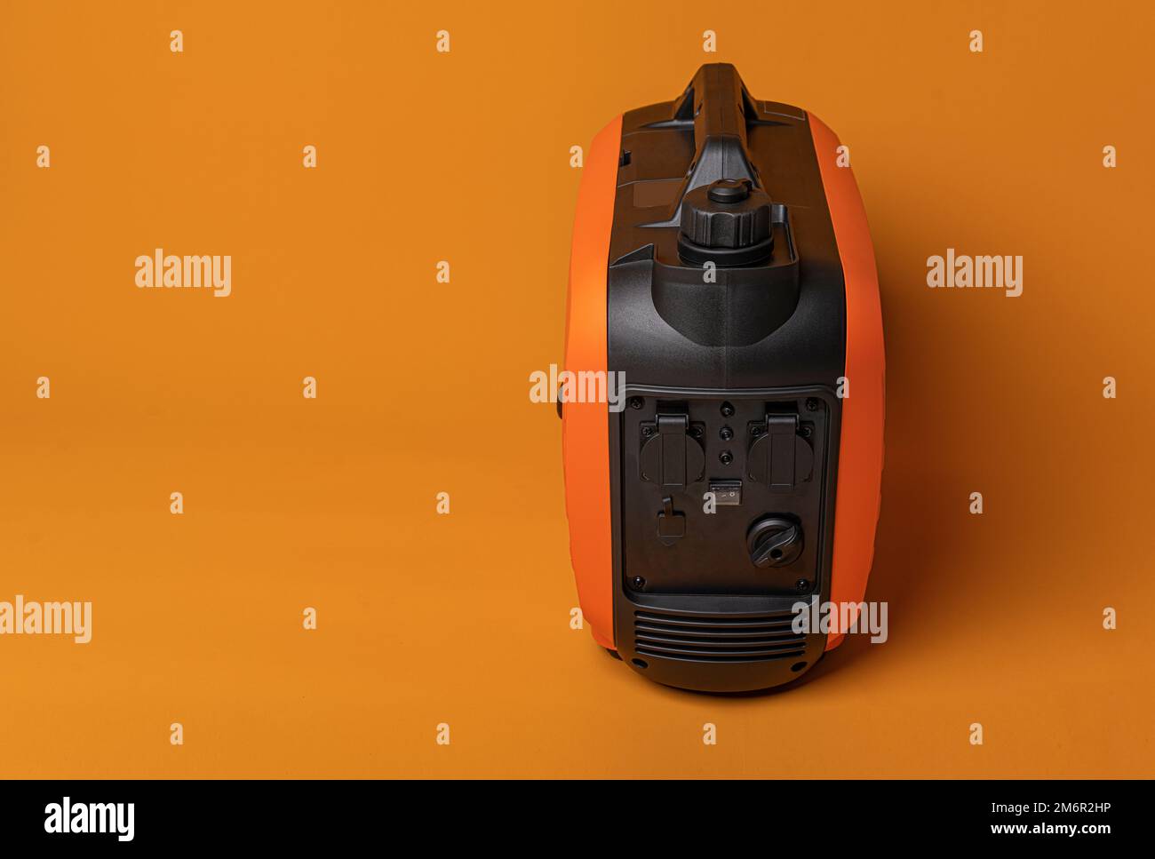 Inverter gasoline generator on an orange background Stock Photo - Alamy