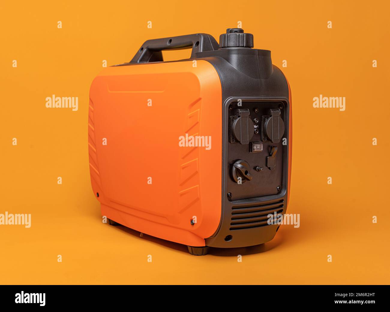 Inverter gasoline generator on an orange background Stock Photo - Alamy