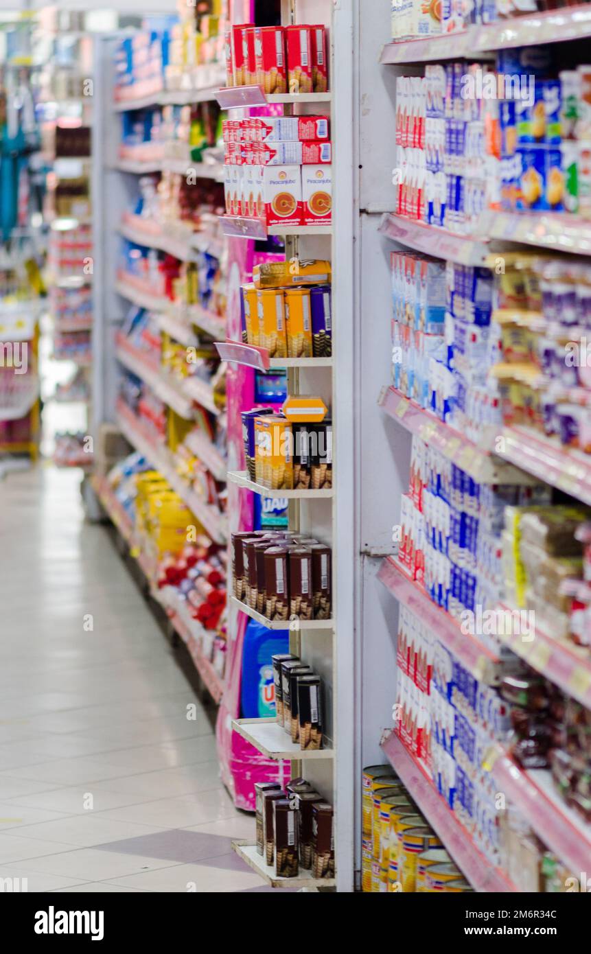 Aisles with products inside a modern supermarket in Brazil, selective ...
