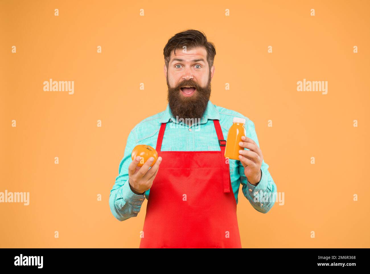 Fresh juice. Squeezing smoothie. Man bearded chef hold organic natural ...