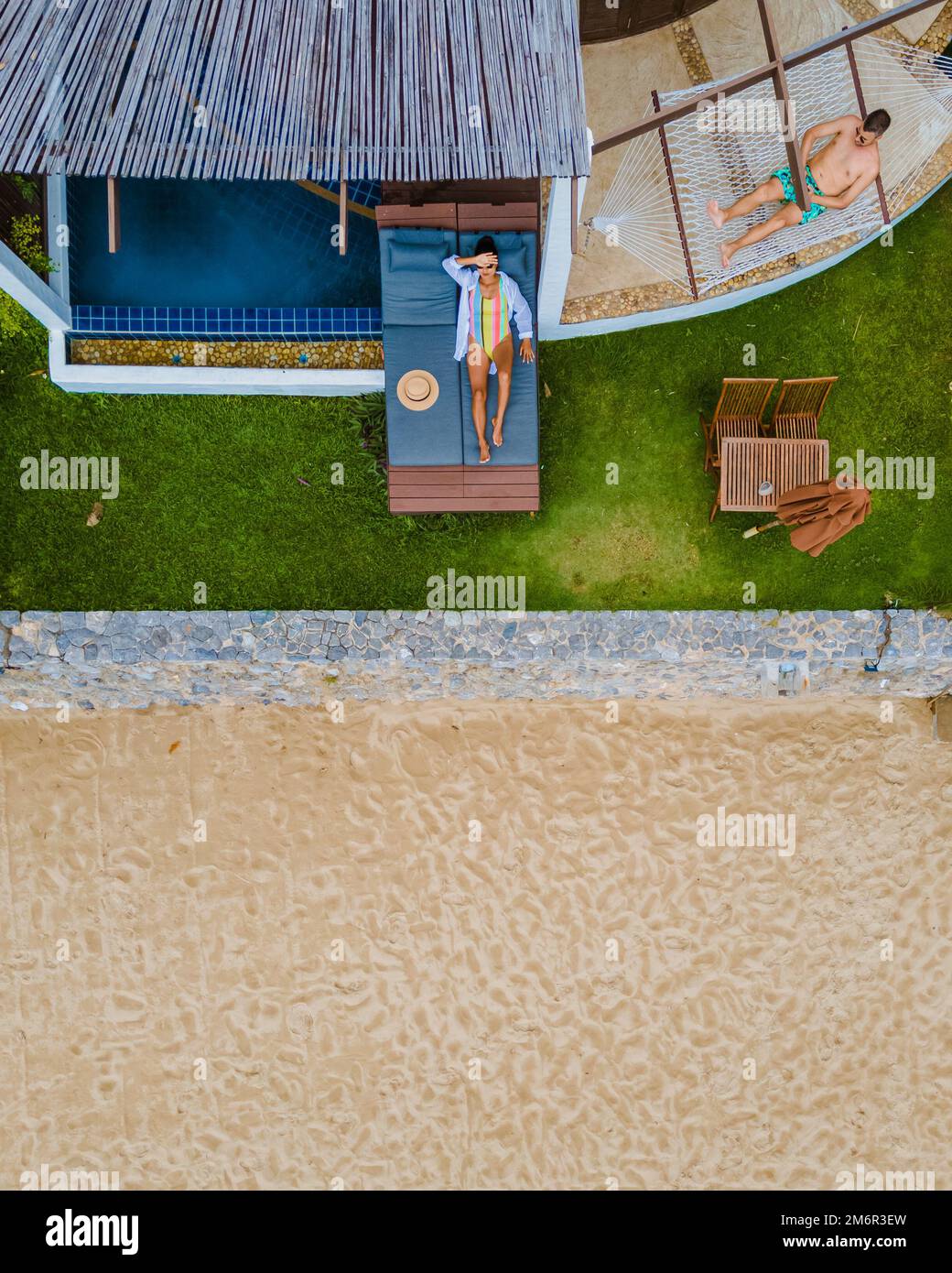 Couple in luxury villa enjoying in the plunge pool looking out over ...