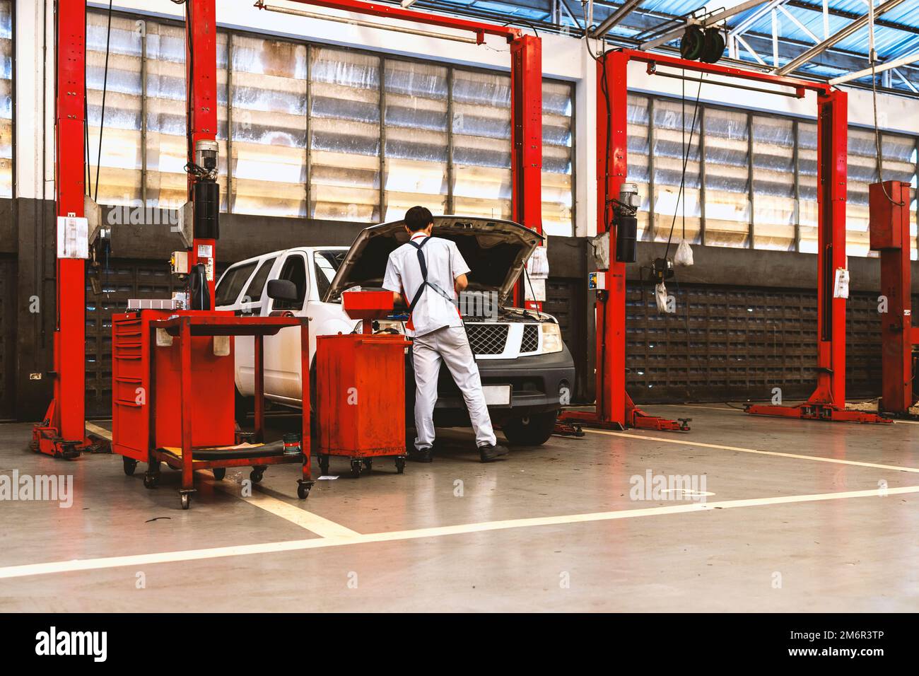 car in automobile repair service center with soft-focus and over light ...
