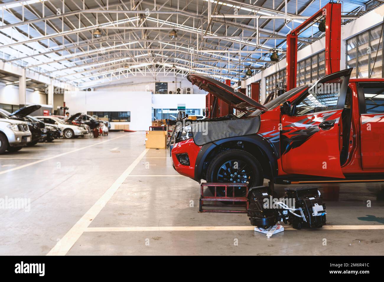 car in automobile repair service center with soft-focus and over light ...