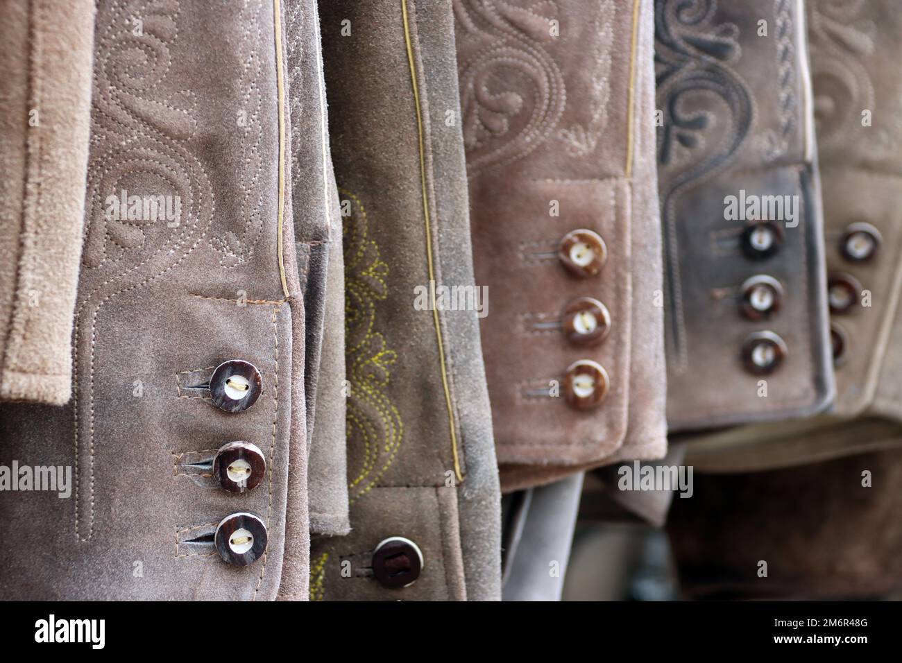 Traditional alpine leather pants with stag horn buttons Stock Photo - Alamy