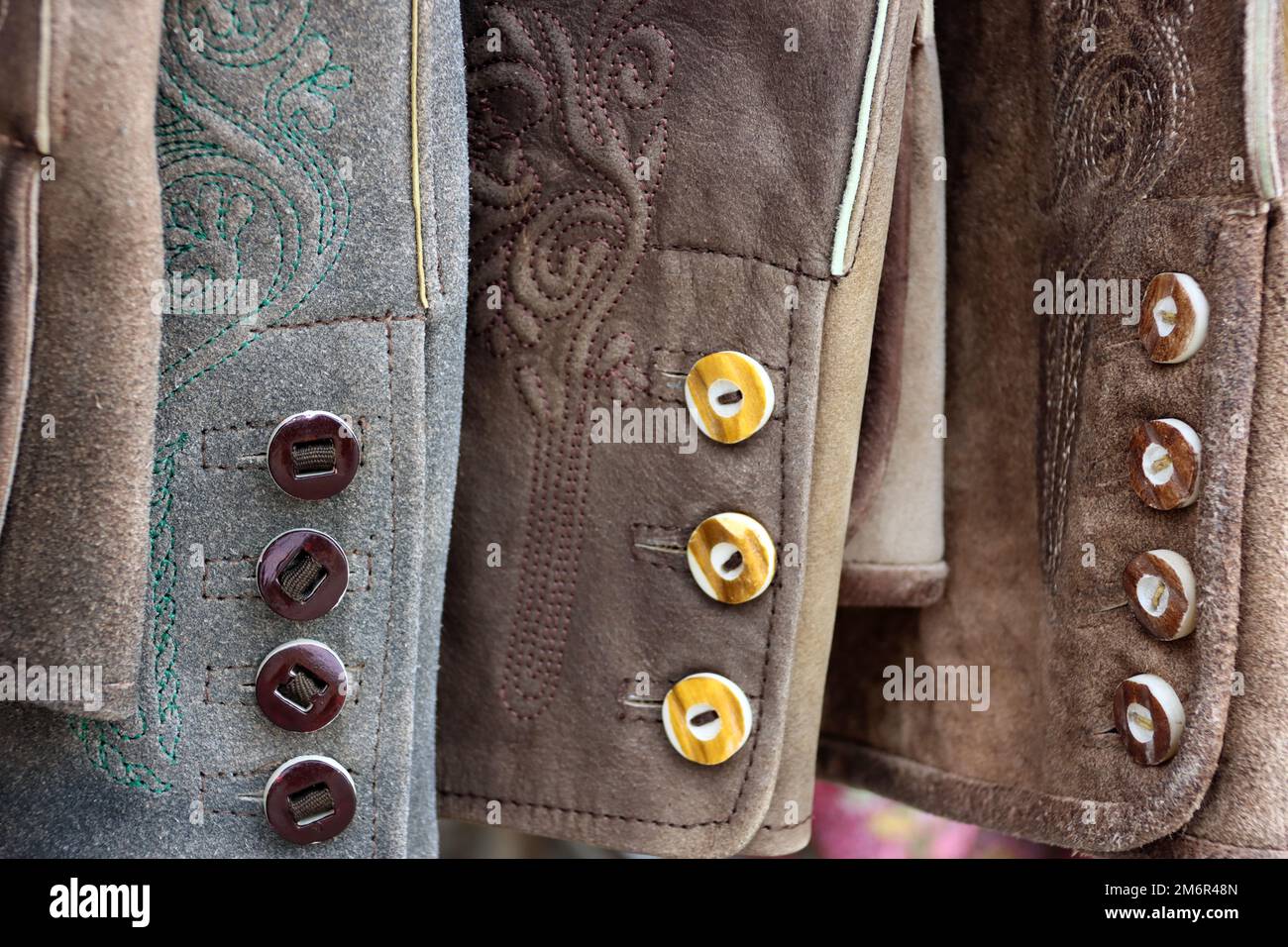Traditional alpine leather pants with stag horn buttons Stock Photo - Alamy