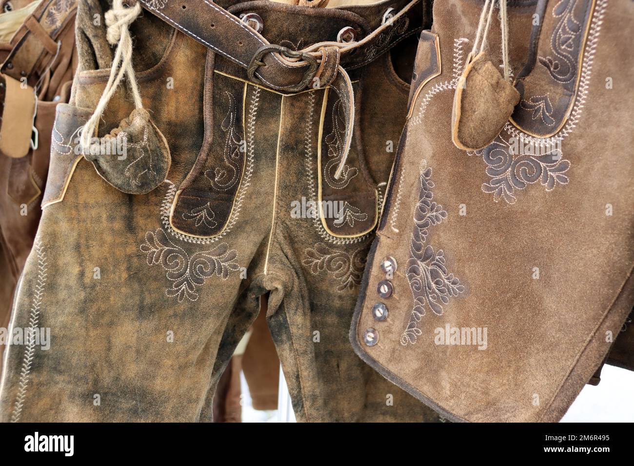 Traditional alpine leather pants with stag horn buttons Stock Photo - Alamy