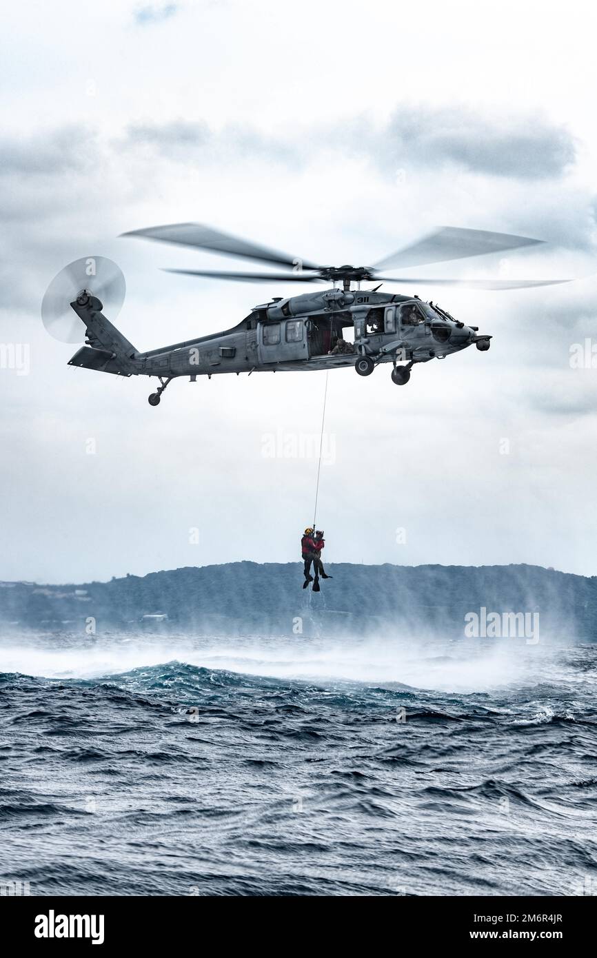 A U.S. Navy MH-60 Sea Hawk helicopter, assigned to Helicopter Sea ...