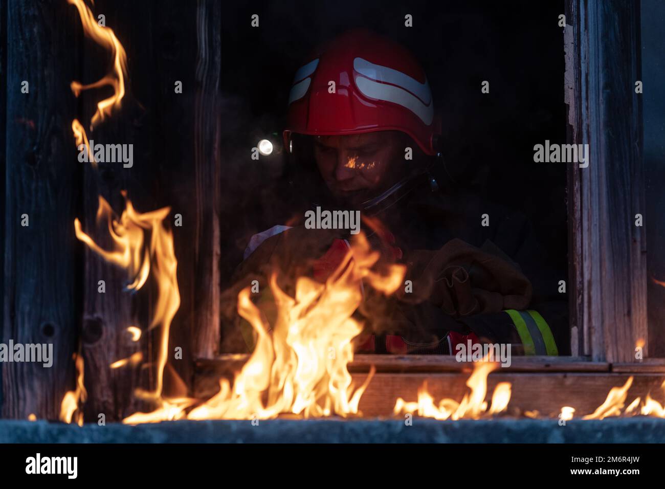 Firefighter hero carrying baby girl out from burning building area from ...