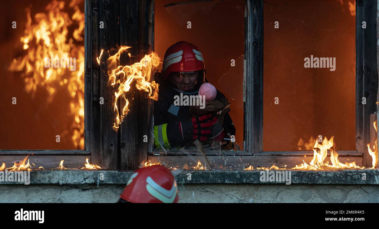 Firefighter Carrying Baby